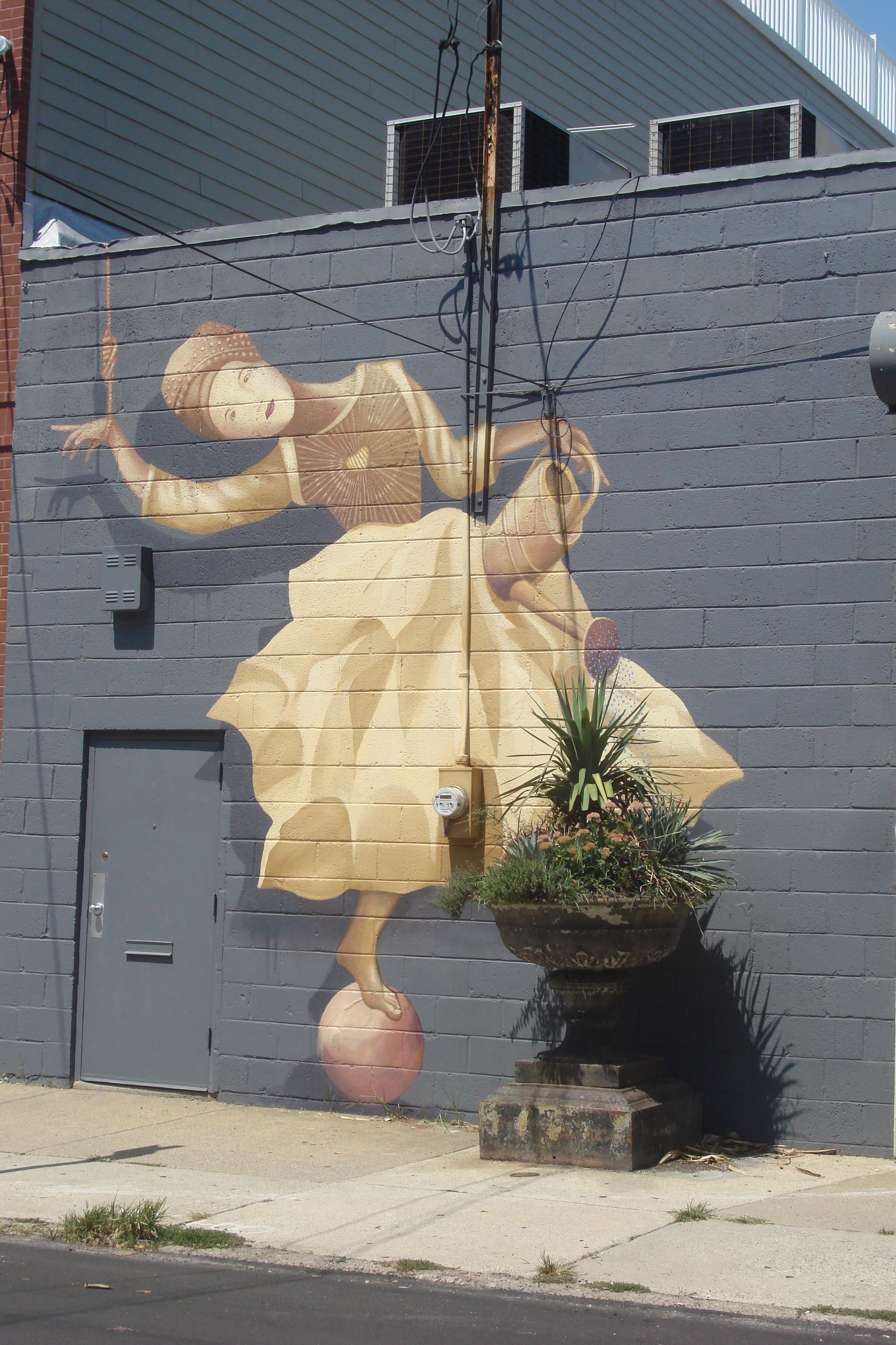 Chained lady watering flowers 2015-1 – Vin de Vie Wine of Life